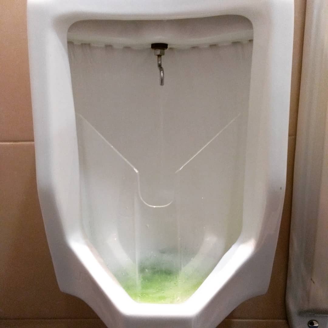 What a good idea.. Urinal splatter guard...why didn't anyone thi ...